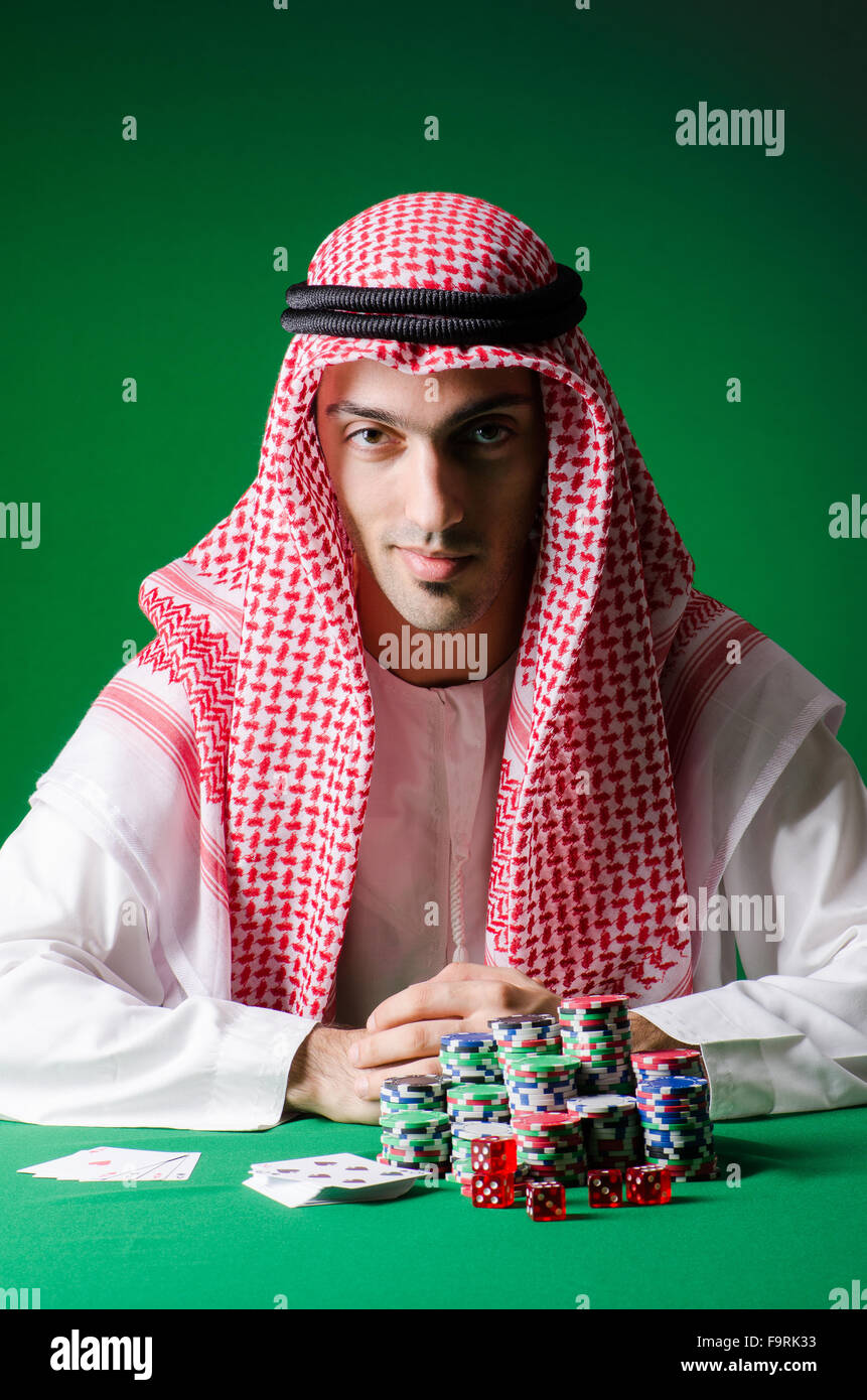 Arab man playing in the casino Stock Photo - Alamy