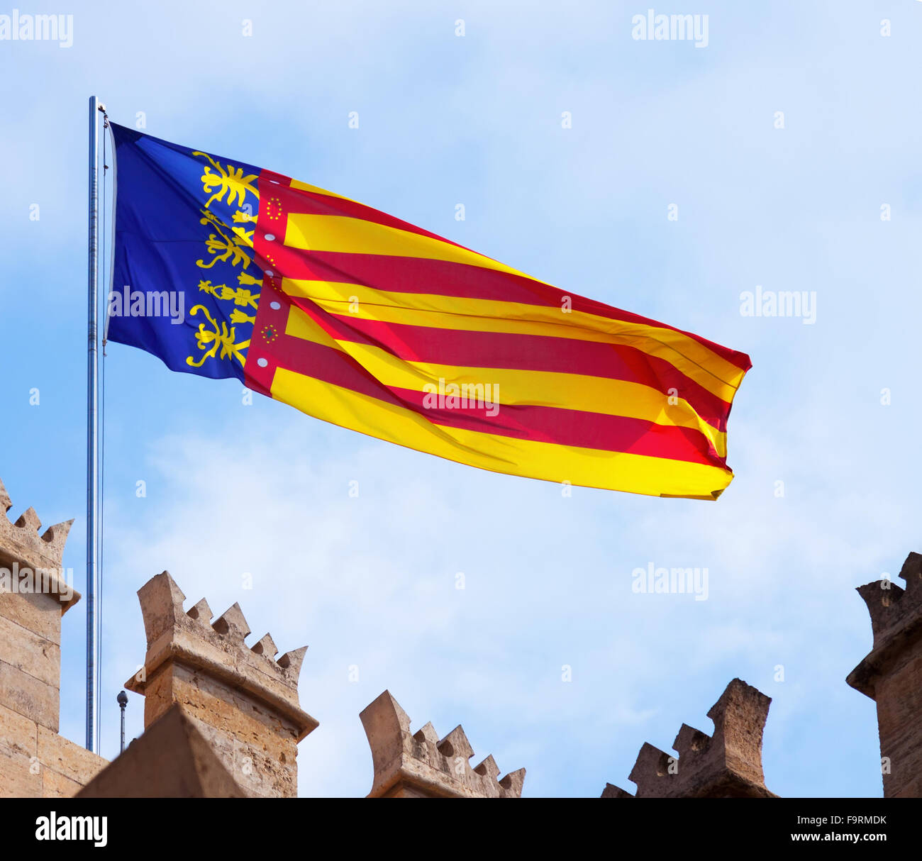 Flying Flag of the Valencian Community Stock Photo - Alamy