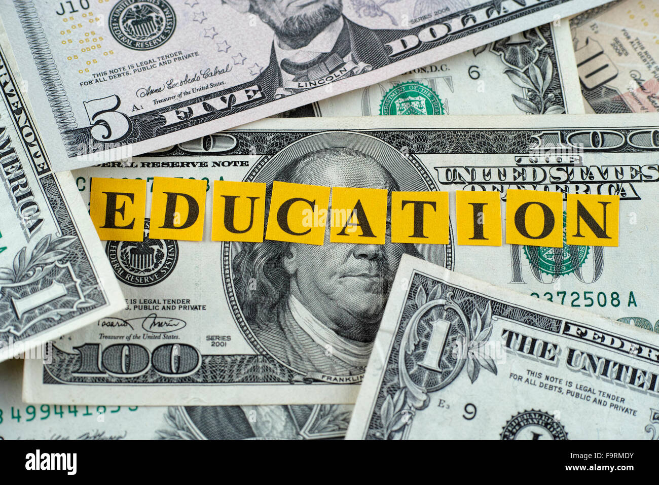 Cost of Education. Word Education on dollar banknotes Stock Photo - Alamy