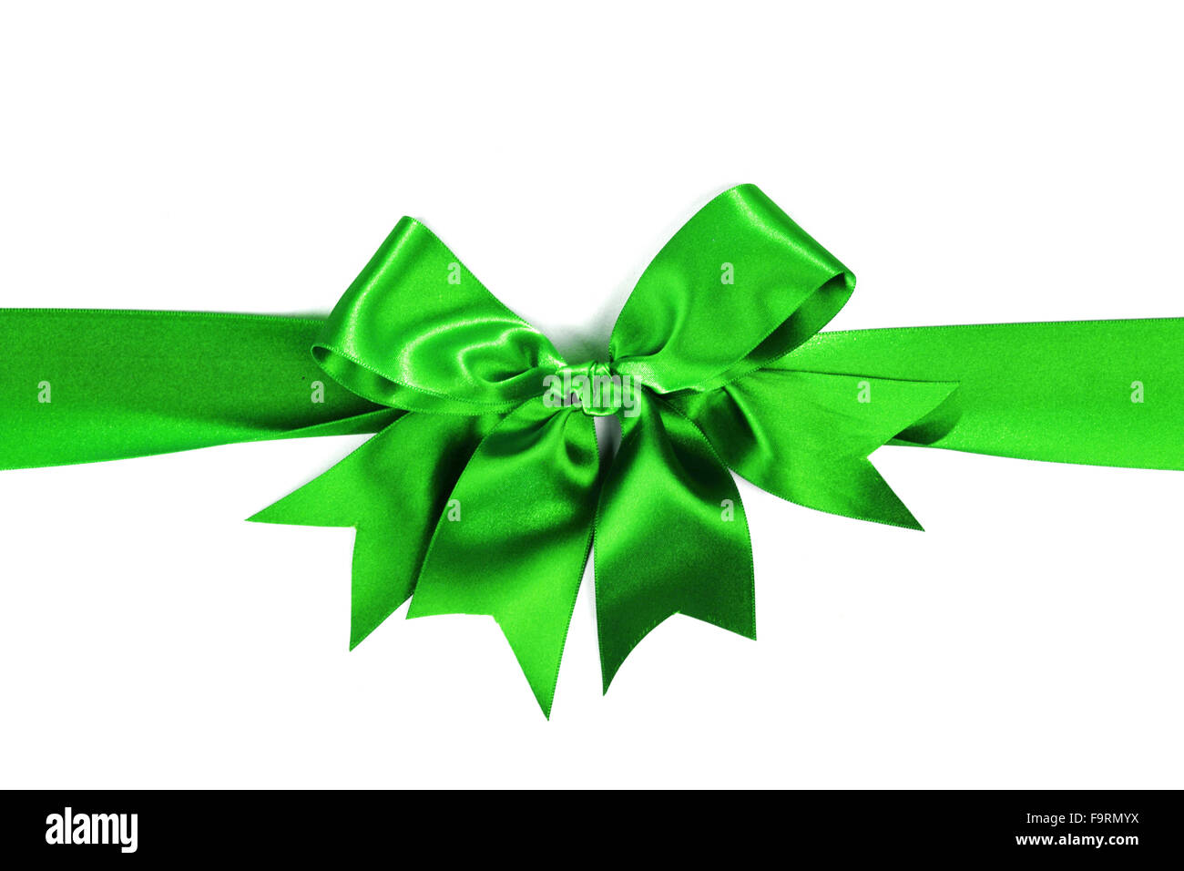 Shiny green satin ribbon with bow on white background Stock Photo - Alamy