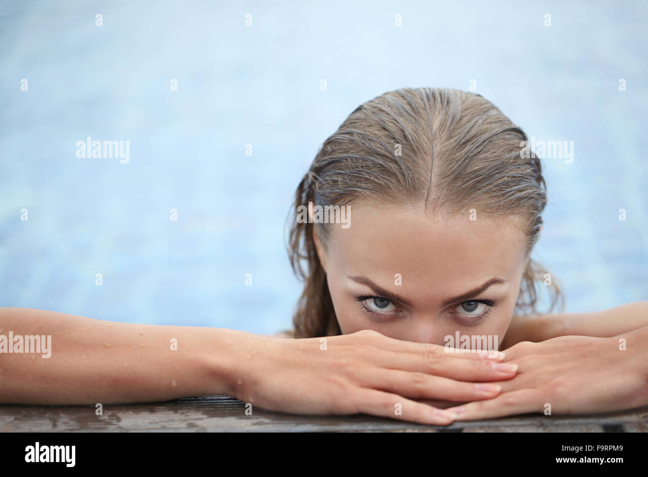Beautiful female model posing pool hi-res stock photography and images ...