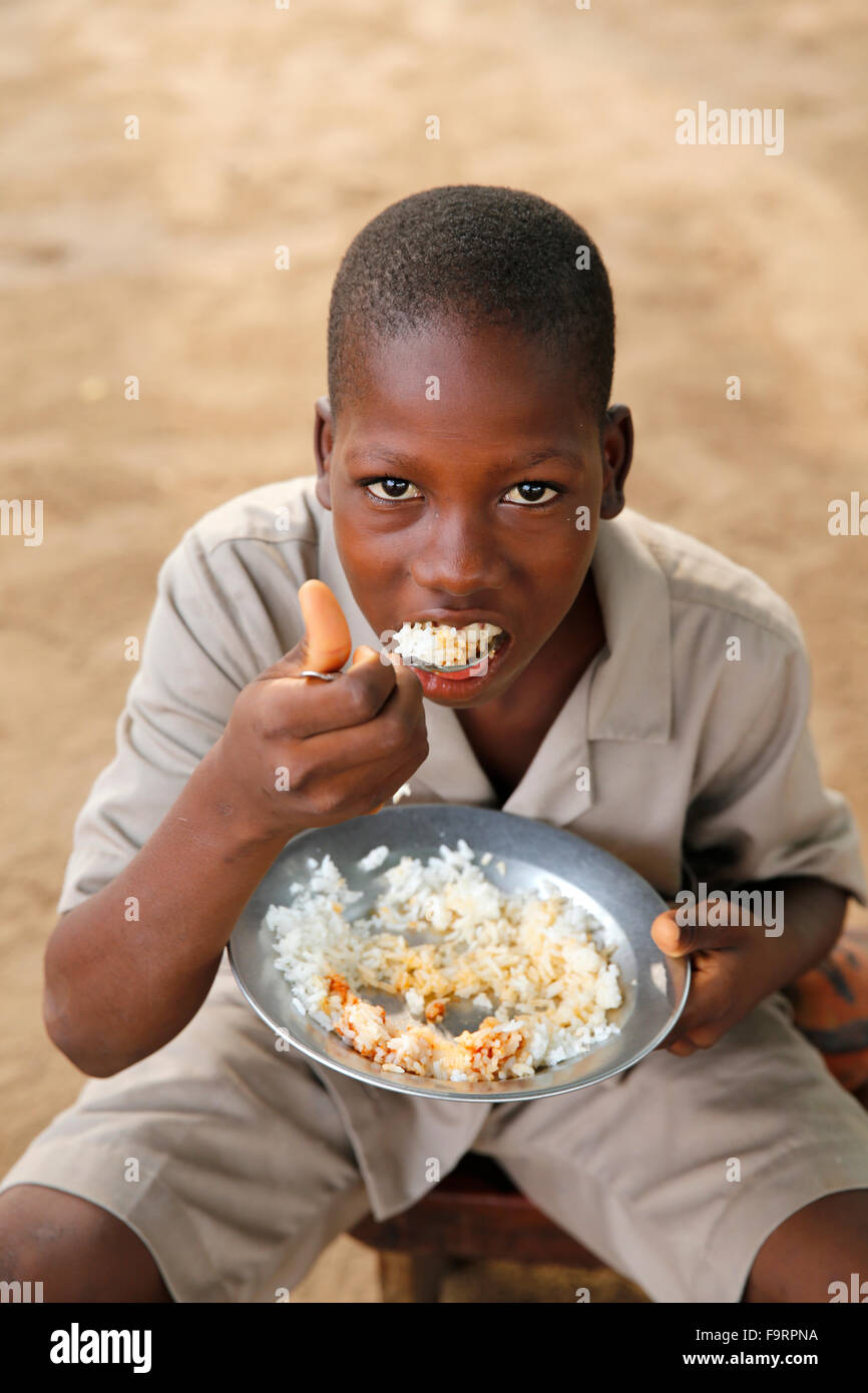 Child eating rice africa hi-res stock photography and images - Alamy