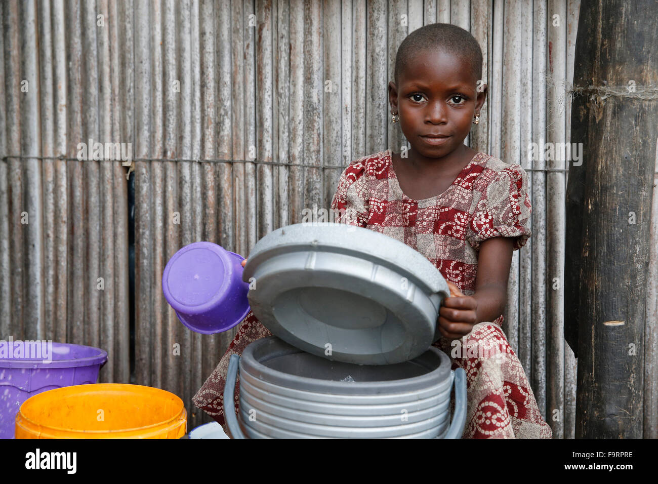 Girl opening a container Stock Photo - Alamy