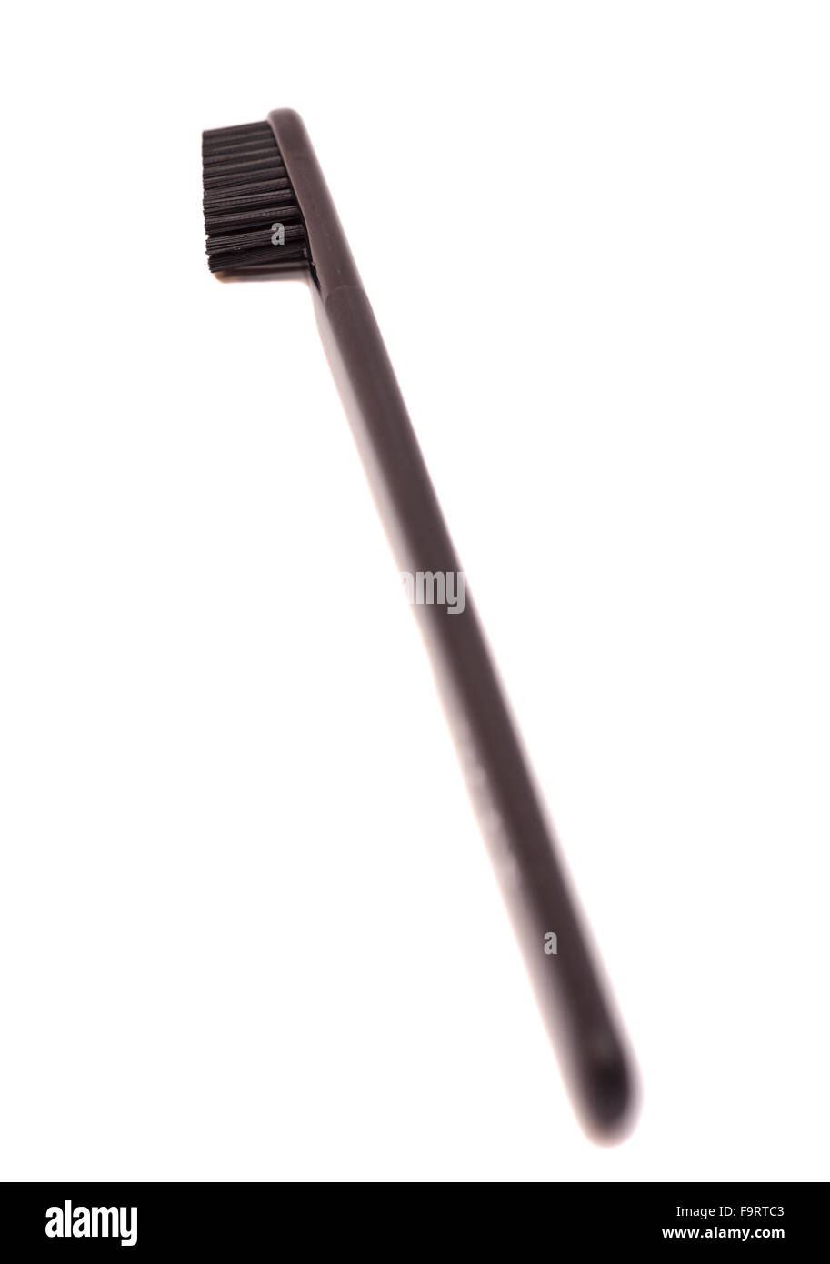 Black toothbrush isolated on white background Stock Photo - Alamy