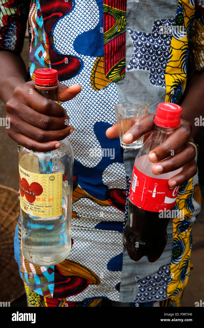 Gin and soft drink offered to a visitor in a Benin home Stock Photo - Alamy