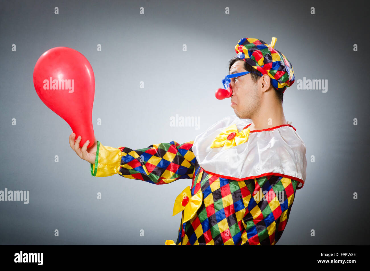 Funny clown in comical concept Stock Photo - Alamy