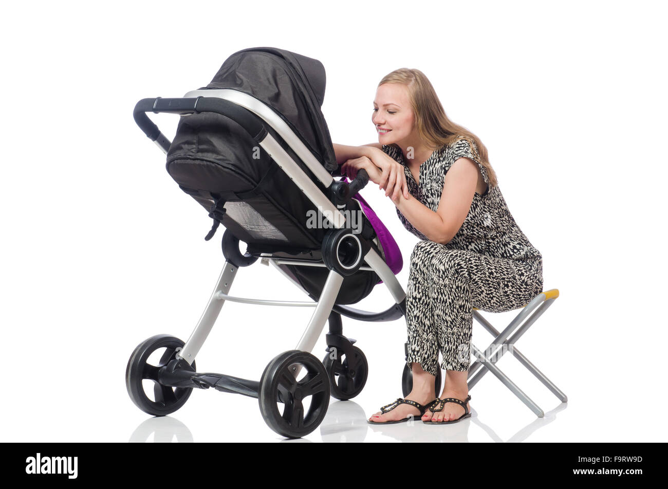 Happy mom with her baby in pram Stock Photo - Alamy