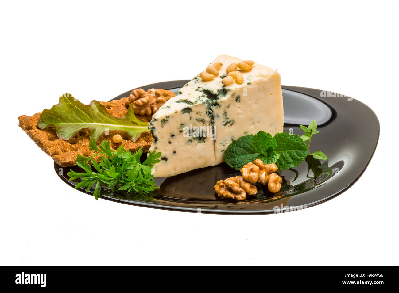 Mould cheese with cress-salad, nuts and crisp Stock Photo - Alamy