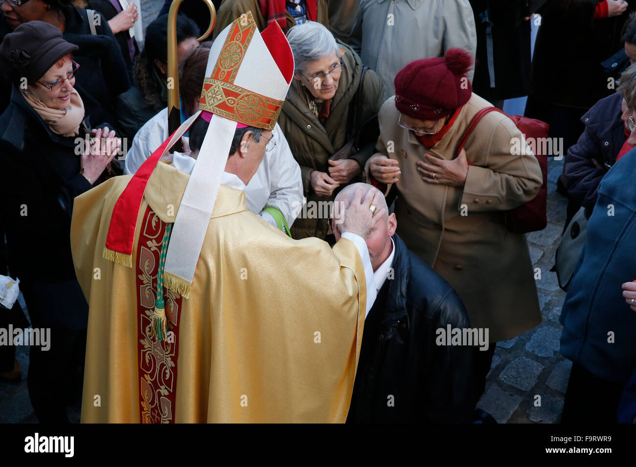 Catholic bishop blessing faithful after mass Stock Photo - Alamy