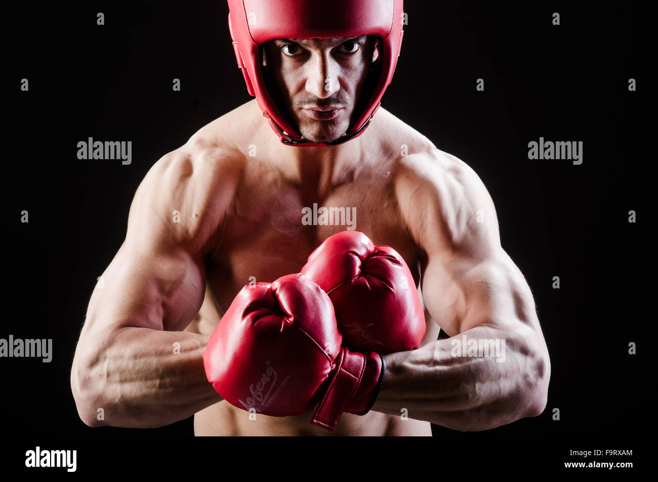 Muscular man in boxing concept Stock Photo - Alamy