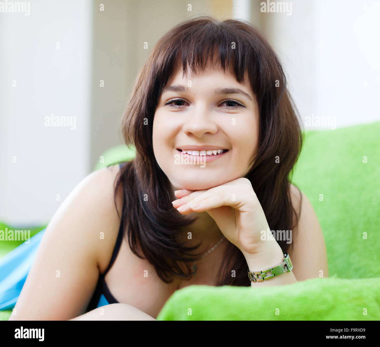Portrait of ordinary woman lying on couch Stock Photo - Alamy