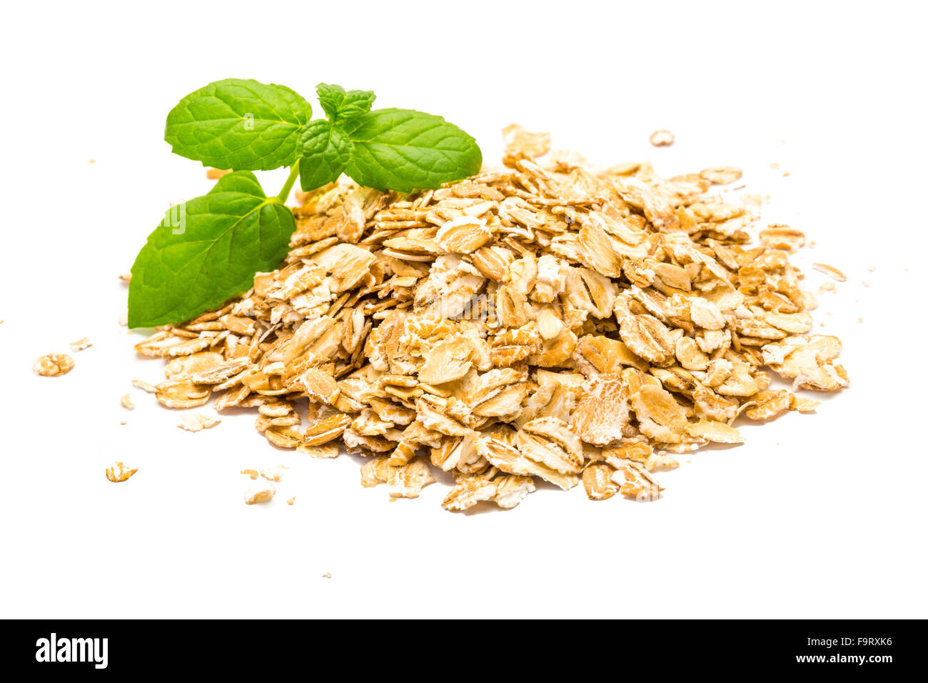 Oats pile with mint branch Stock Photo - Alamy