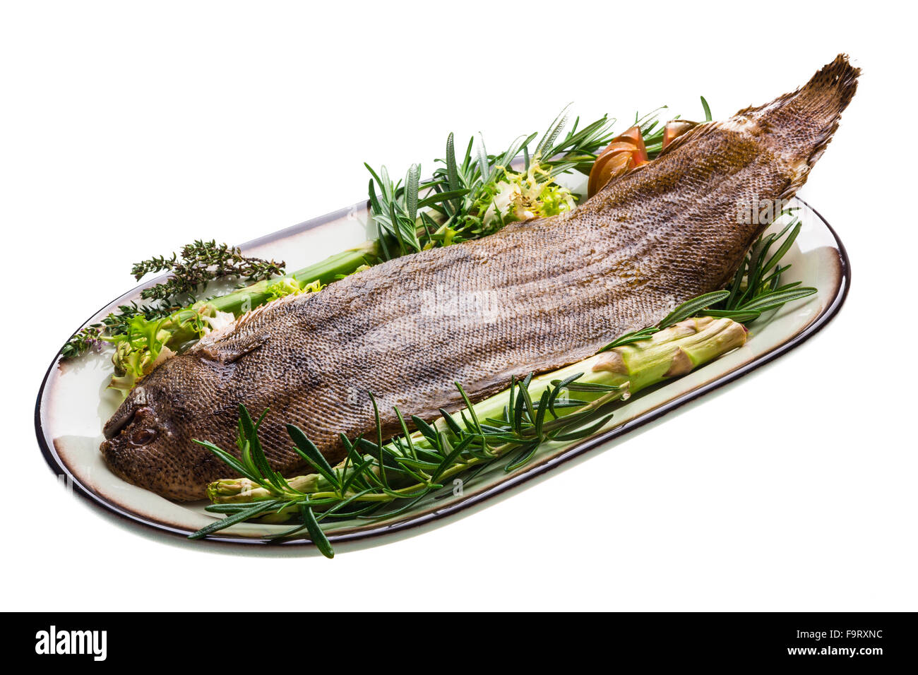 Fish Dover sole roasted Stock Photo - Alamy