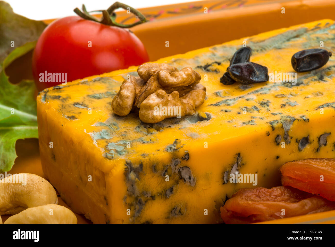 Gold cheese with mould Stock Photo - Alamy