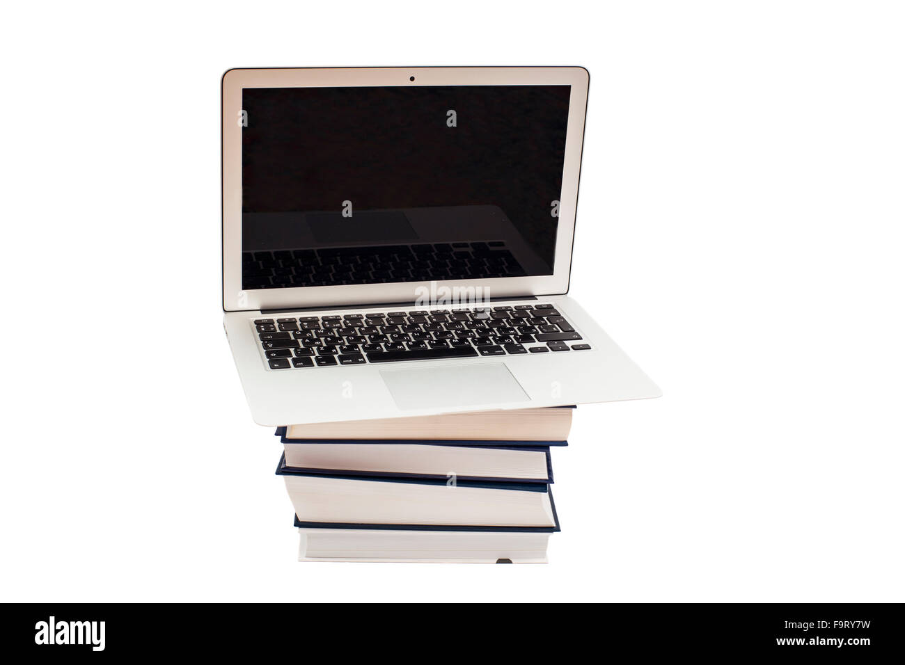Books and laptop Stock Photo - Alamy