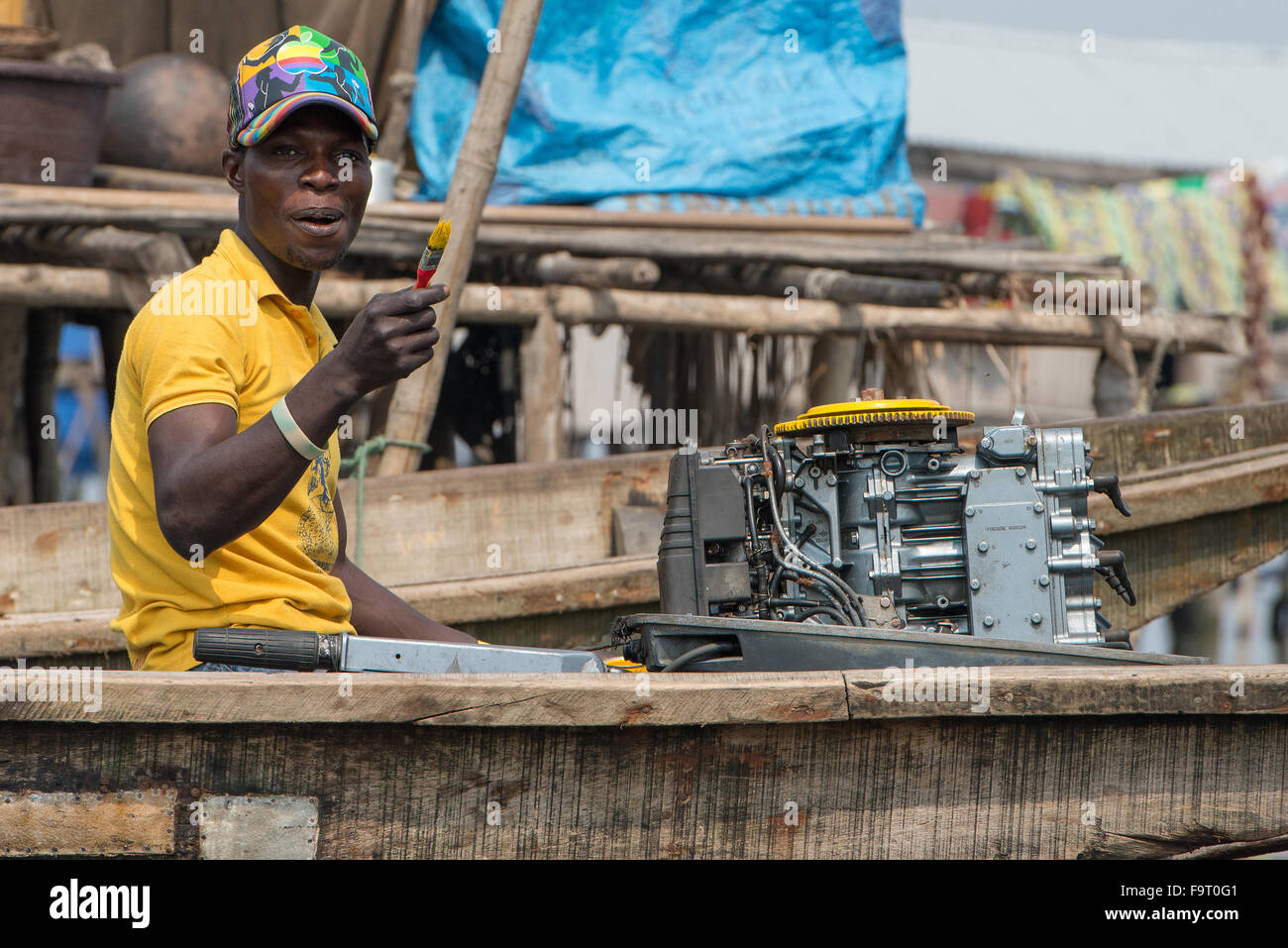 Man fixing an engine boat Stock Photo - Alamy