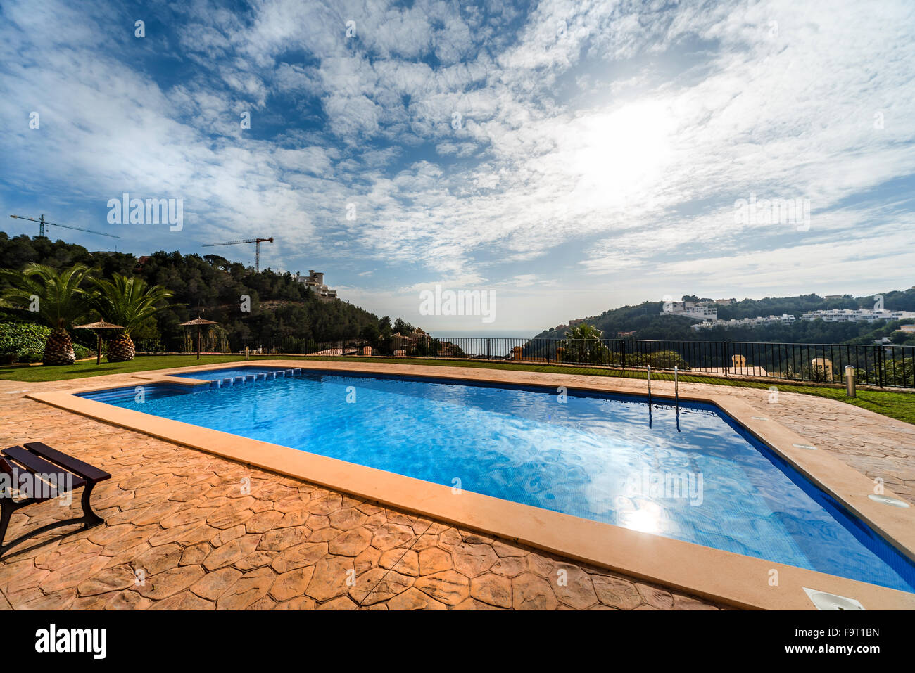 Swimming pool with a scenic landscape Stock Photo - Alamy