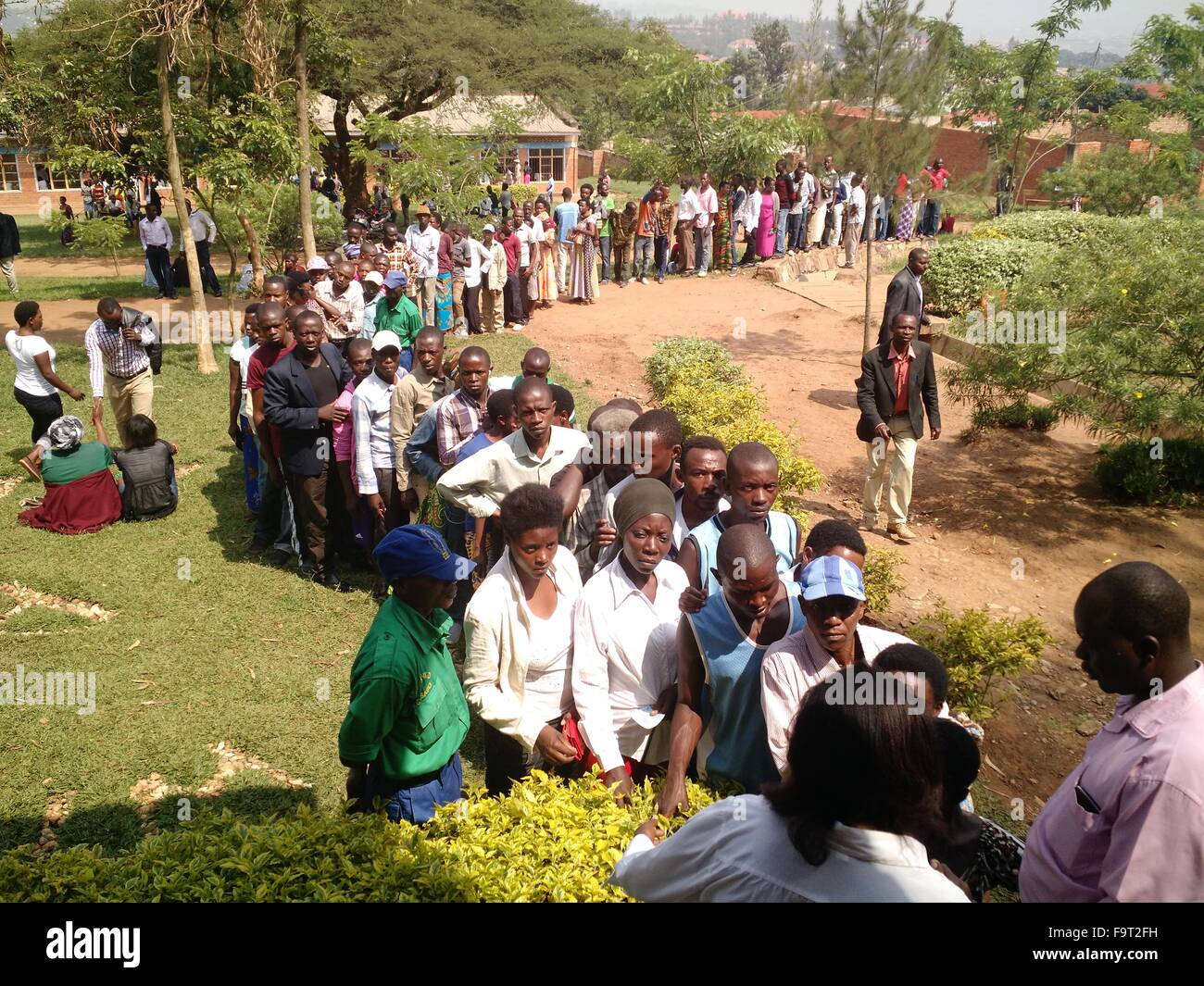 Kigali, Rwanda. 18th Dec, 2015. Voters queue in front of an election ...