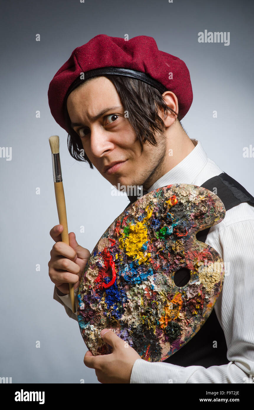 Funny artist in dark studio Stock Photo - Alamy