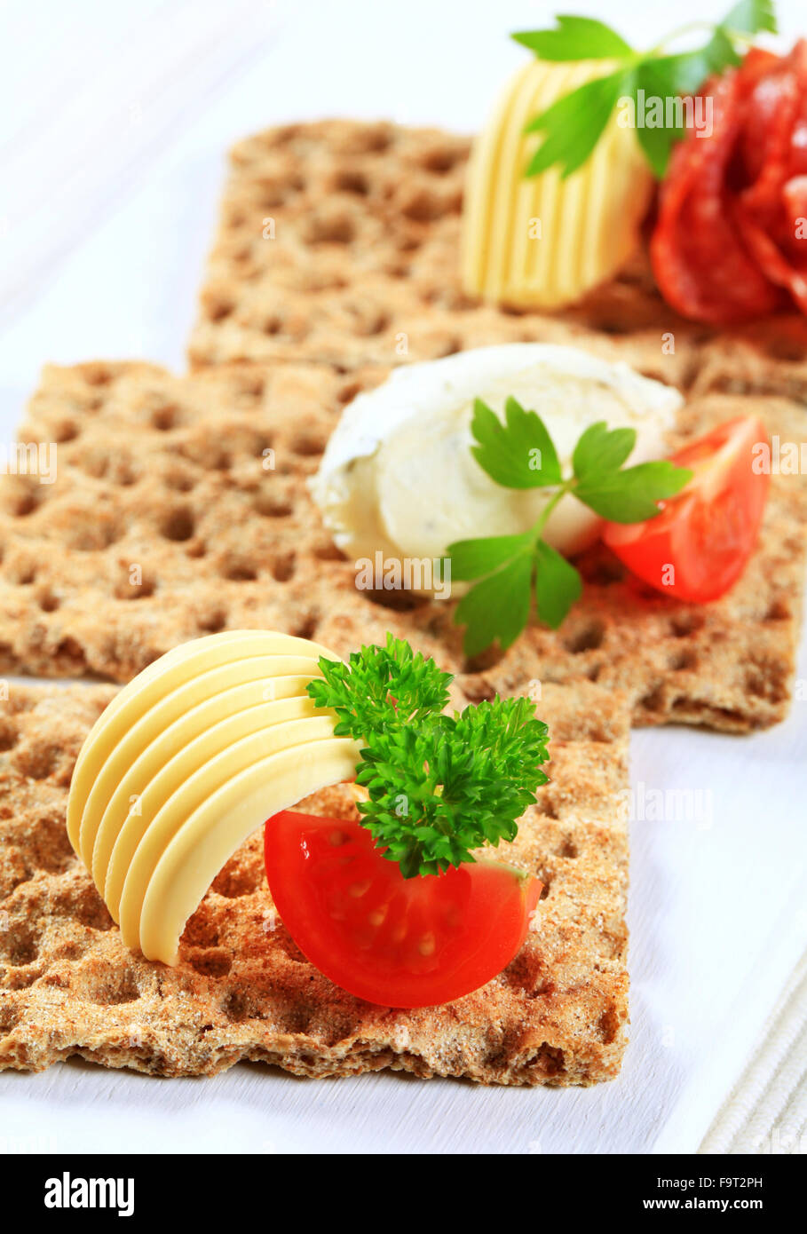 Whole grain crisp bread slices with various toppings Stock Photo - Alamy
