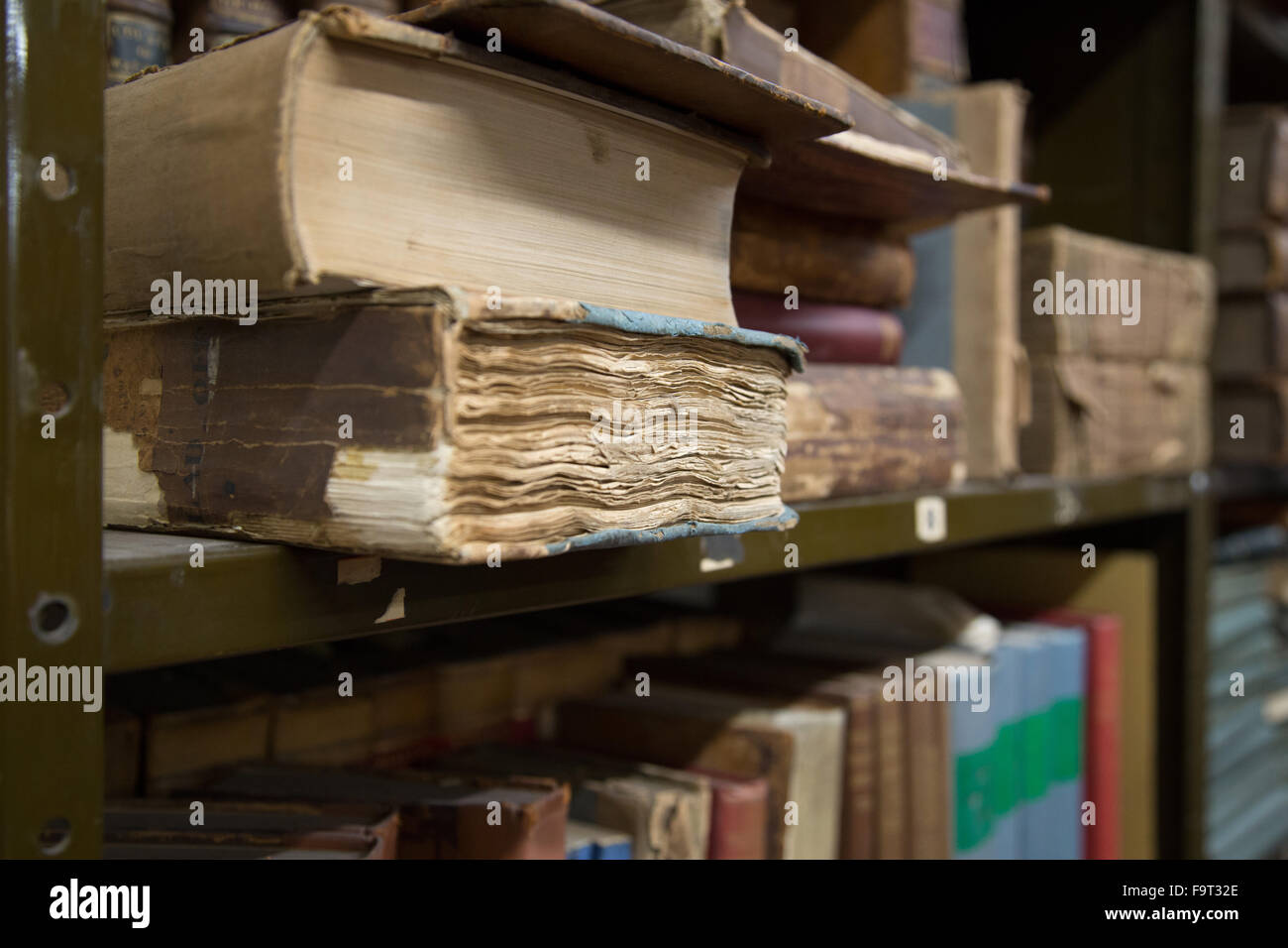 Legal text books and files stored on shelves in a record office Stock ...