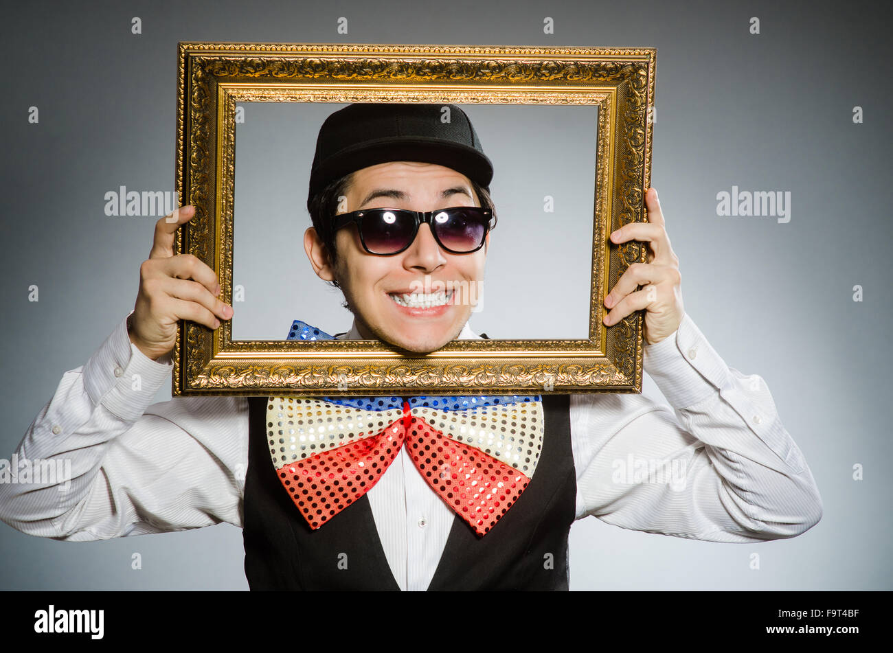 Funny man with picture frame Stock Photo - Alamy