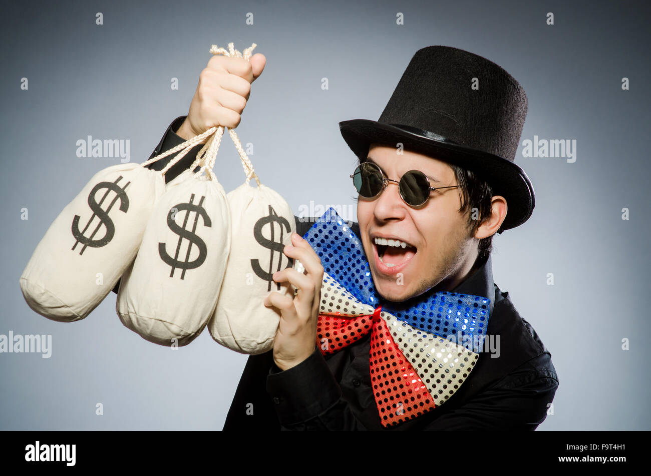 Funny man with money dollar sacks Stock Photo - Alamy