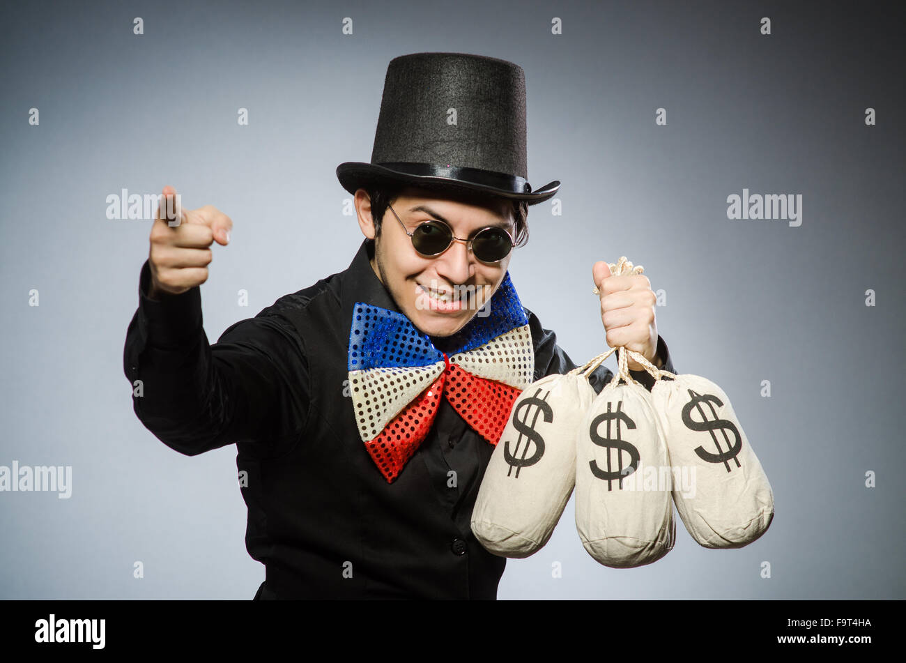 Funny man with money dollar sacks Stock Photo - Alamy