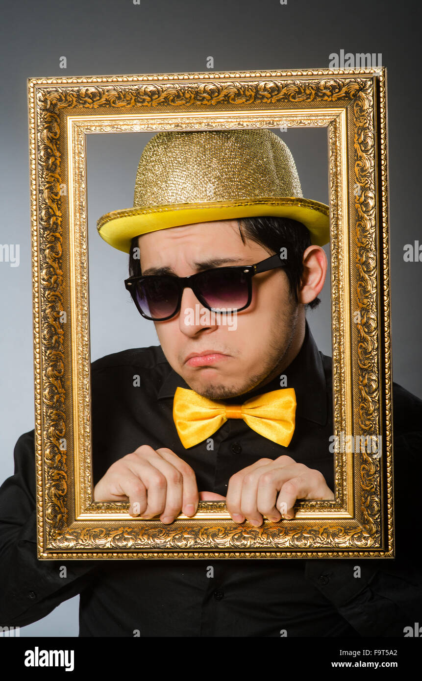 Funny man with picture frame Stock Photo - Alamy
