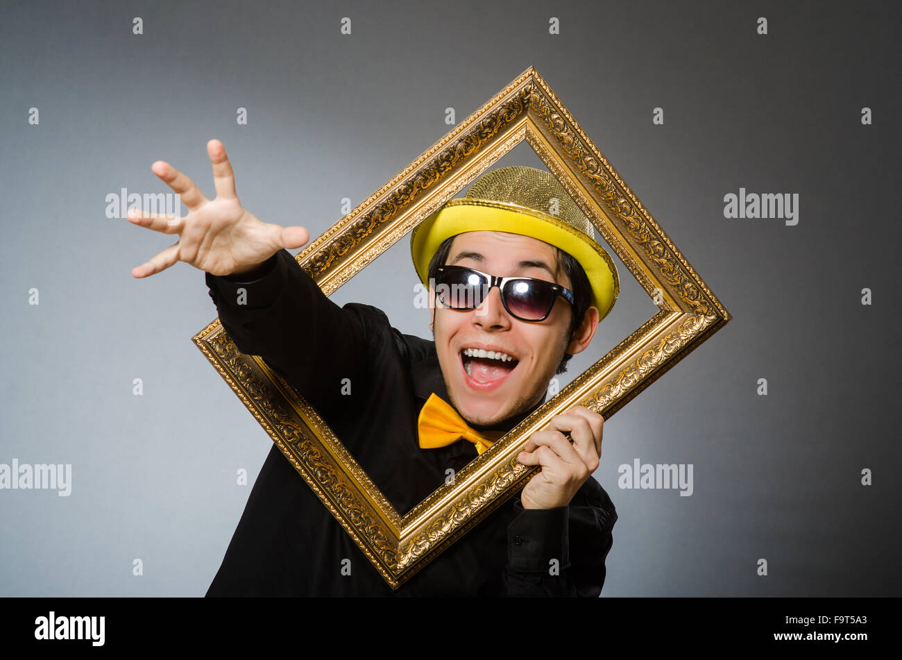 Funny man with picture frame Stock Photo - Alamy