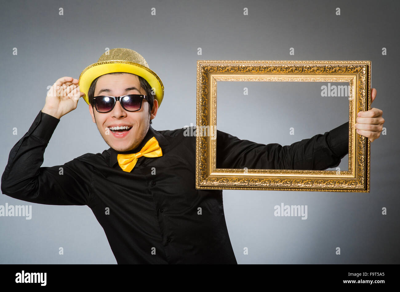 Funny man with picture frame Stock Photo - Alamy