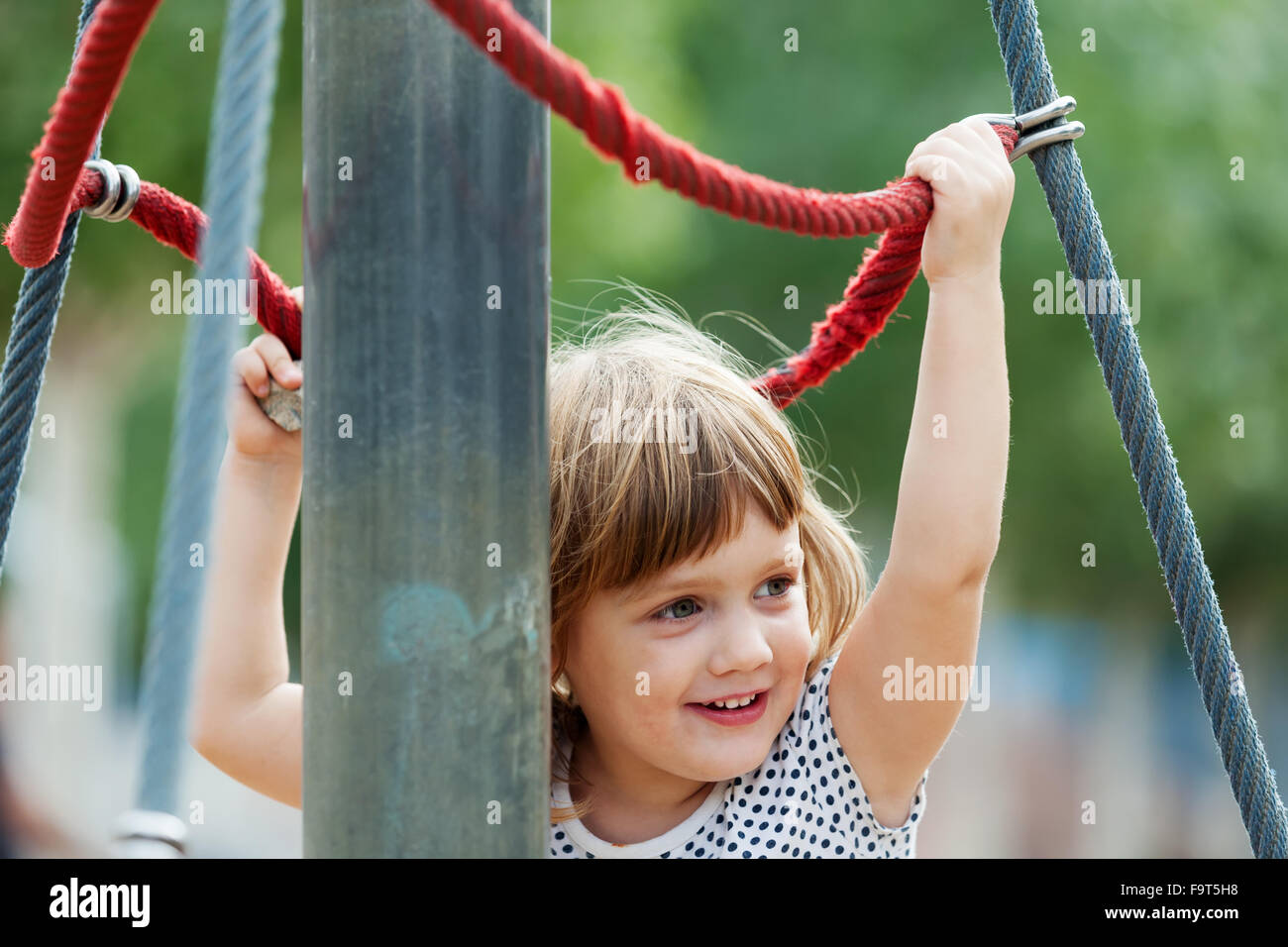 Happy children on rope slide hi-res stock photography and images - Alamy