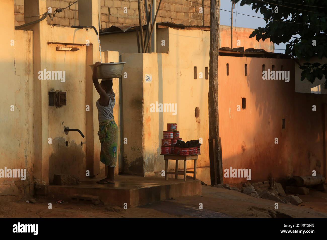 African fetching water with a bucket Stock Photo - Alamy