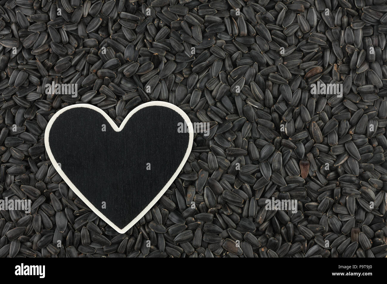 Heart pointer, the price tag lies on sunflower seeds, with space for ...
