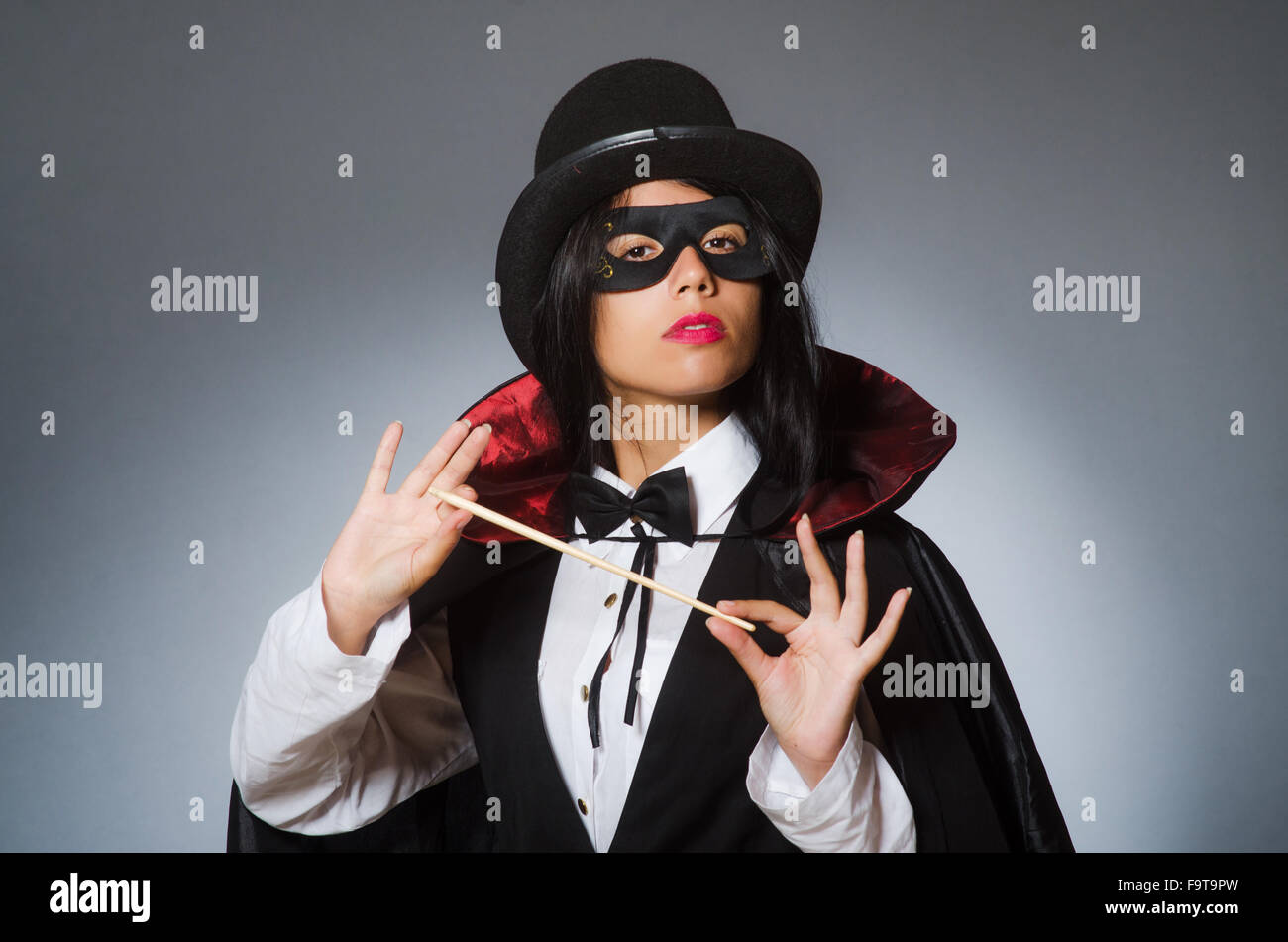 Woman magician in funny concept Stock Photo - Alamy