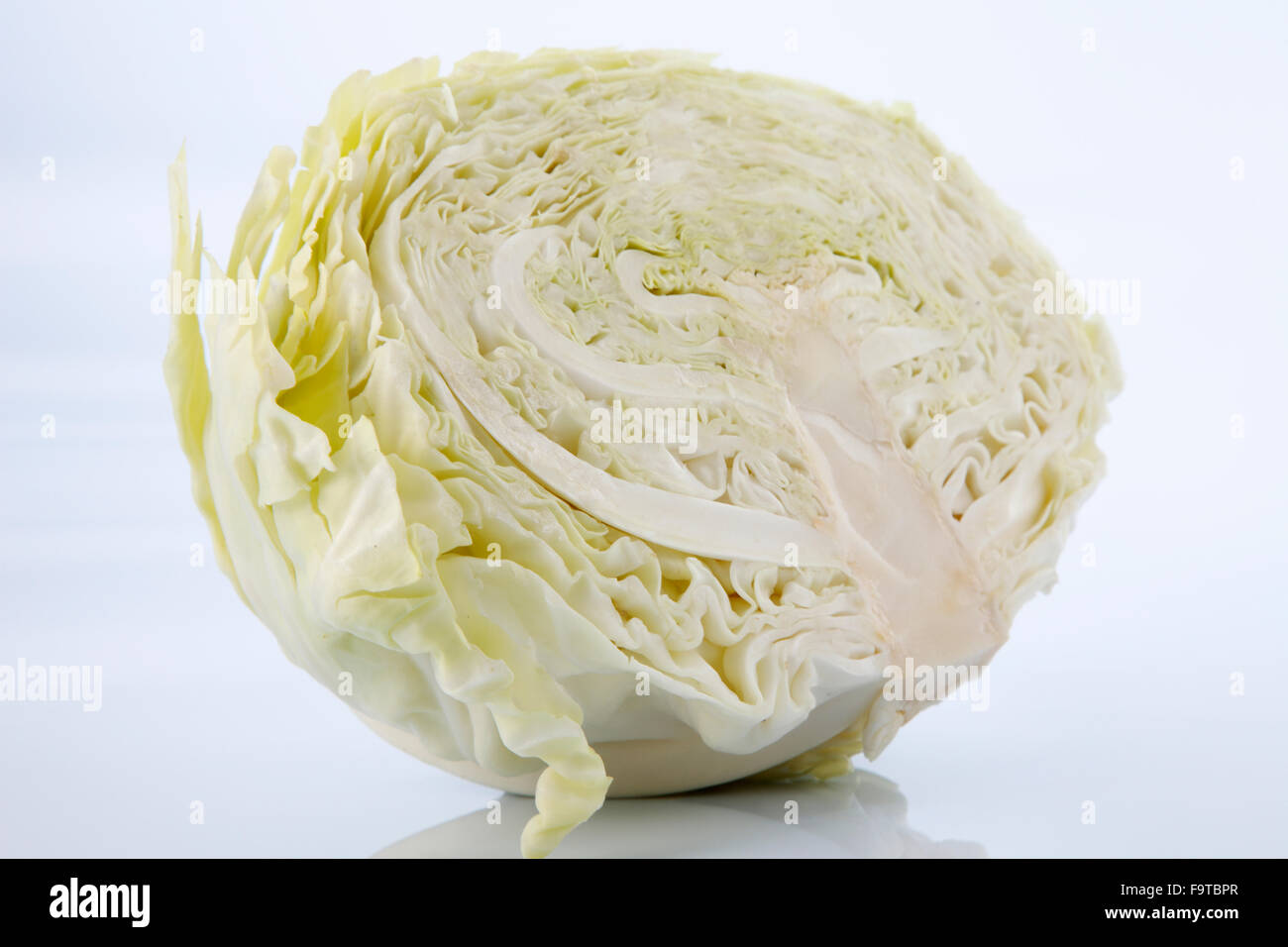 Cabbage cut in half isolated on white background Stock Photo - Alamy