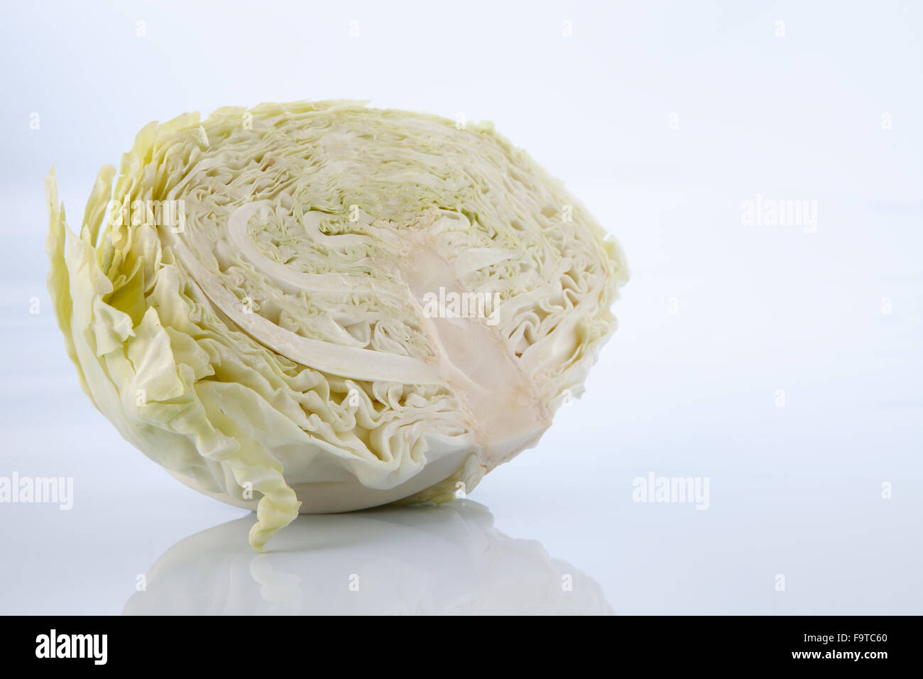 Cabbage cut in half isolated on white background Stock Photo - Alamy