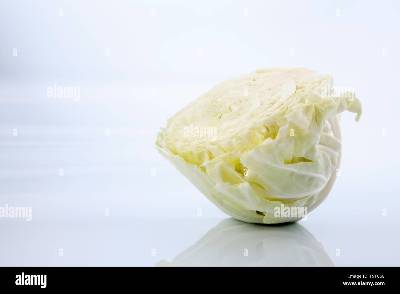 Cabbage cut in half isolated on white background Stock Photo - Alamy