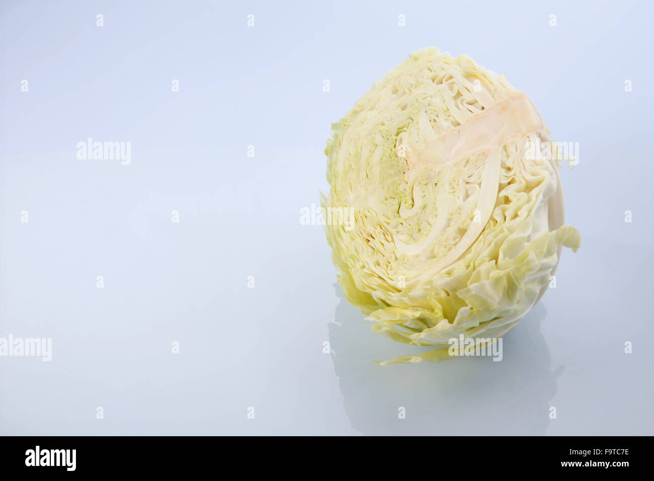 Cabbage cut in half isolated on white background Stock Photo - Alamy