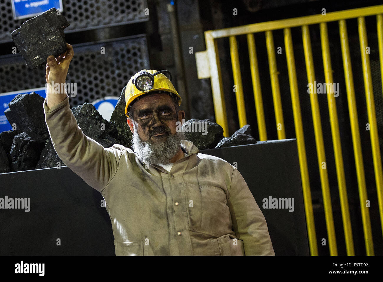 Marl, Germany. 18th Dec, 2015. A miner holds a brick of coal in his ...