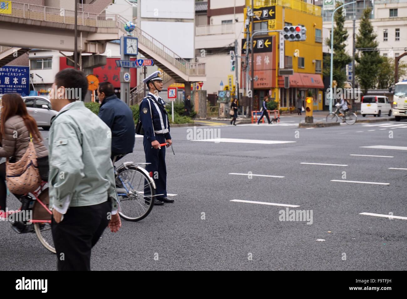 Traffic policeman directing traffic cyclists hi-res stock photography ...