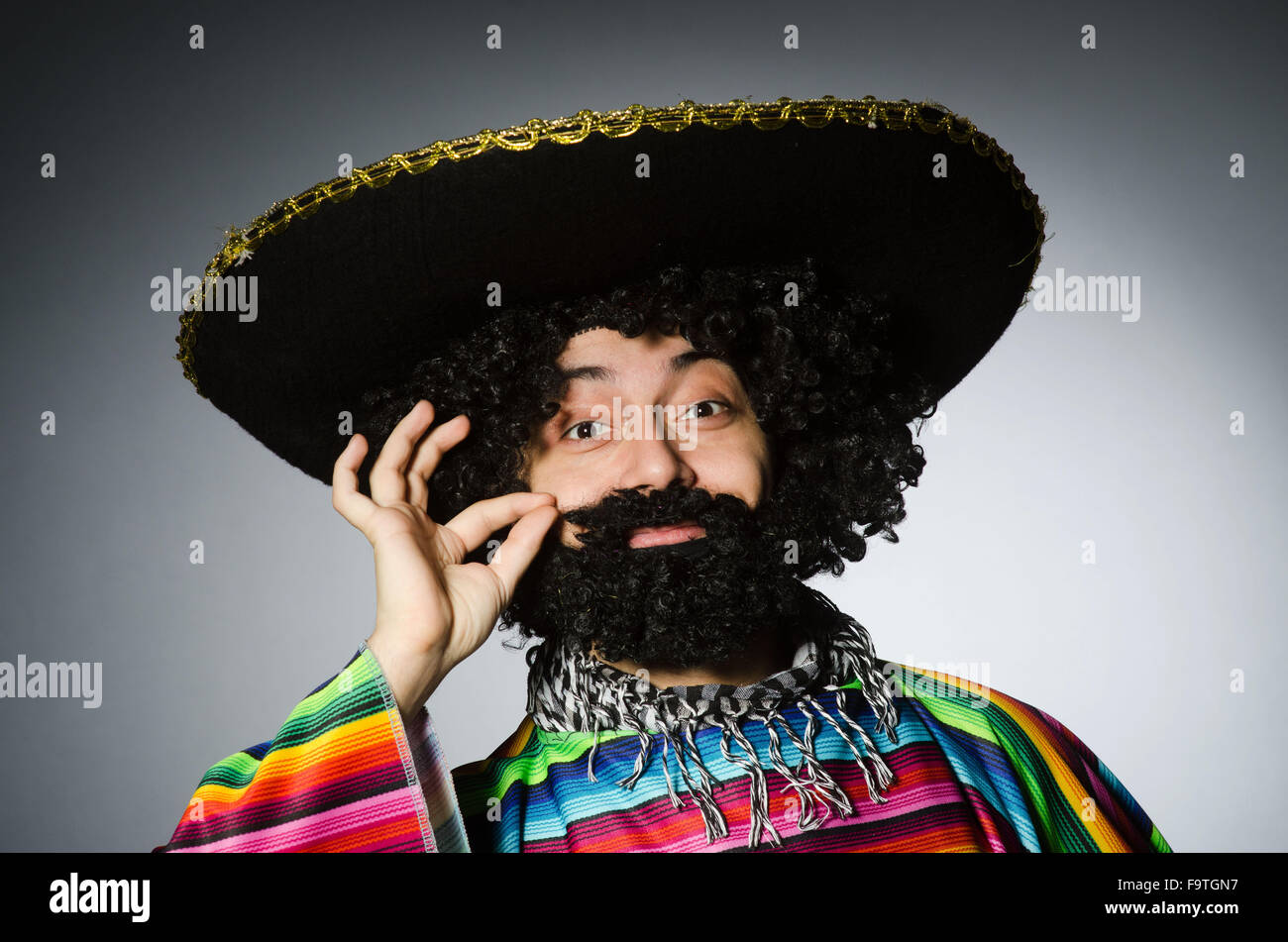 Person wearing sombrero hat in funny concept Stock Photo - Alamy