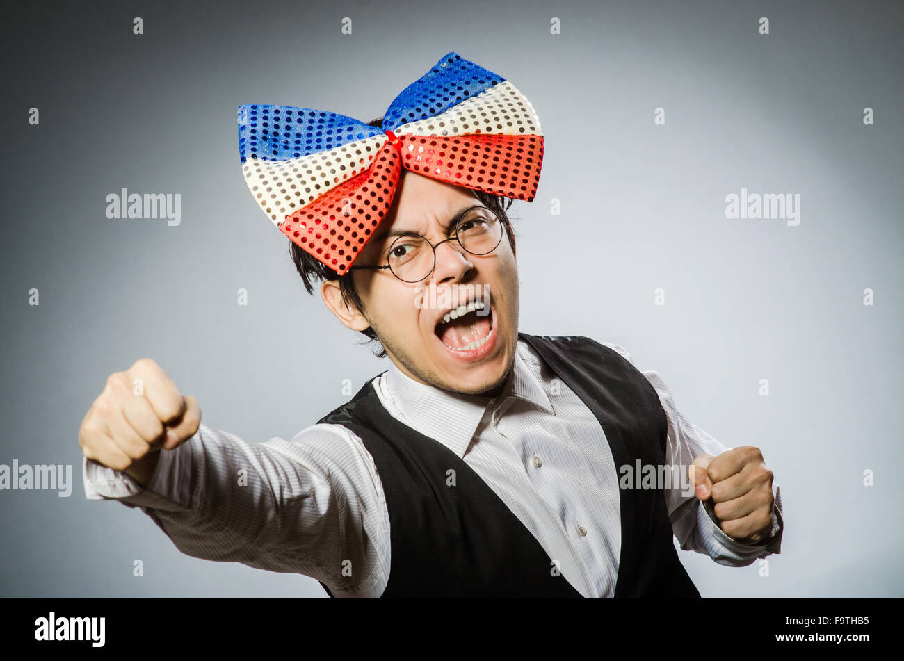 Funny man with giant bow tie Stock Photo - Alamy