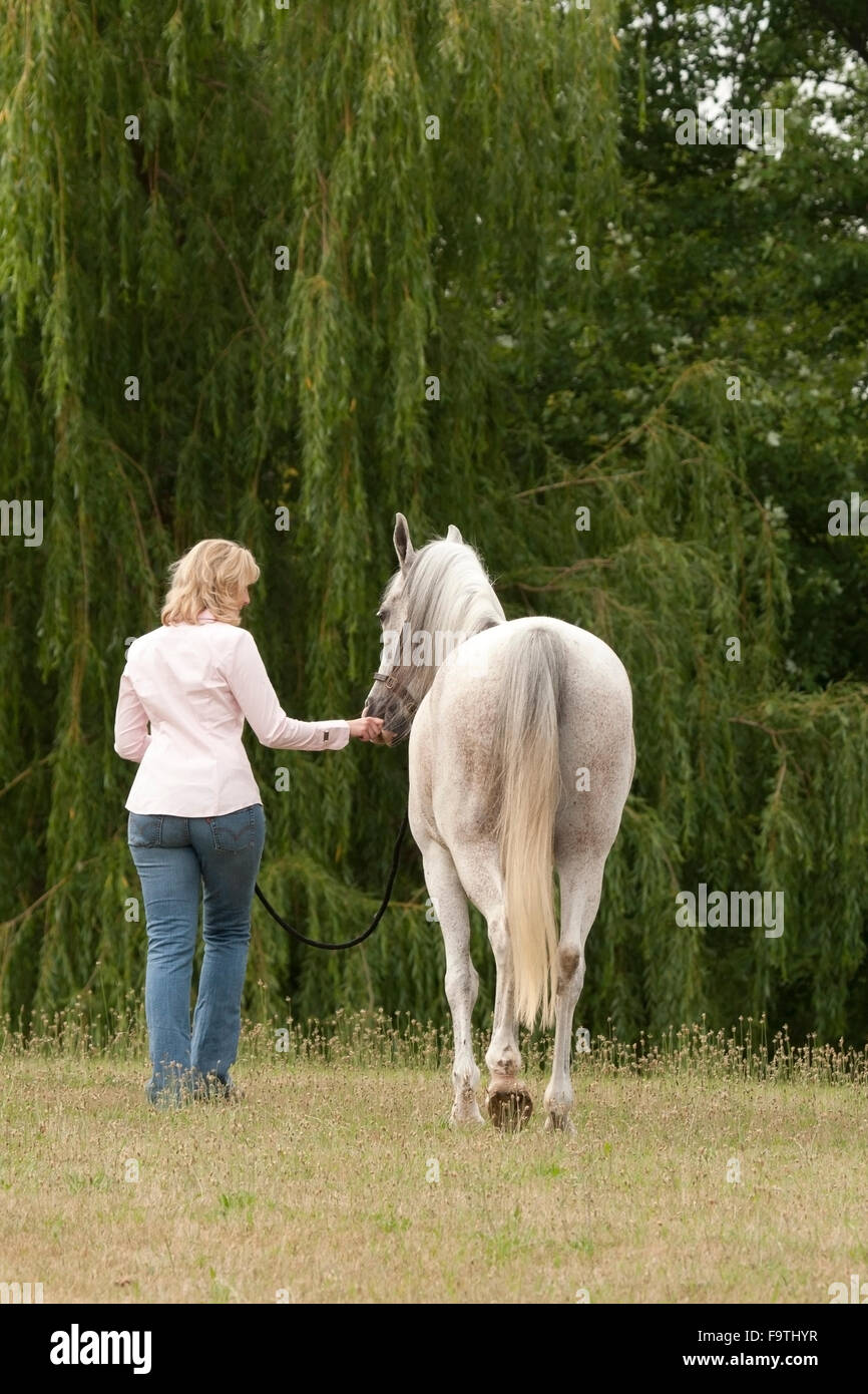 Woman walks away from camera hi-res stock photography and images - Alamy