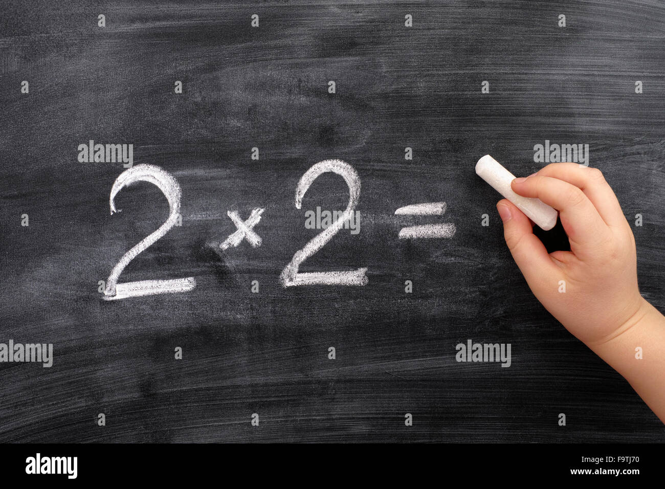 Child solving math problem on the blackboard. Multiplication Stock ... Child solving math problem on the blackboard. Multiplication Stock ...