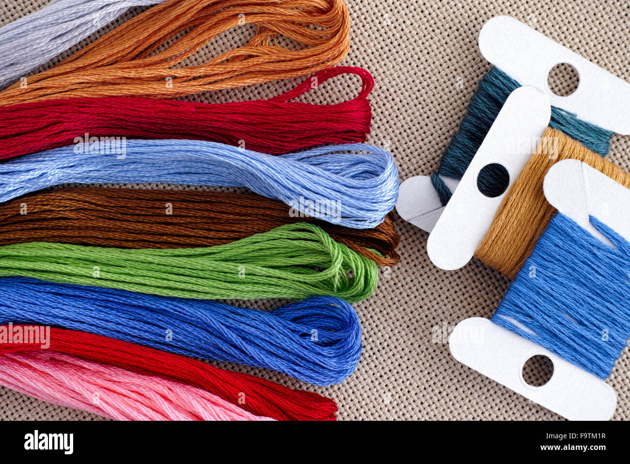 Cross stitch threads and embroidery thread cards. Close up Stock Photo ...