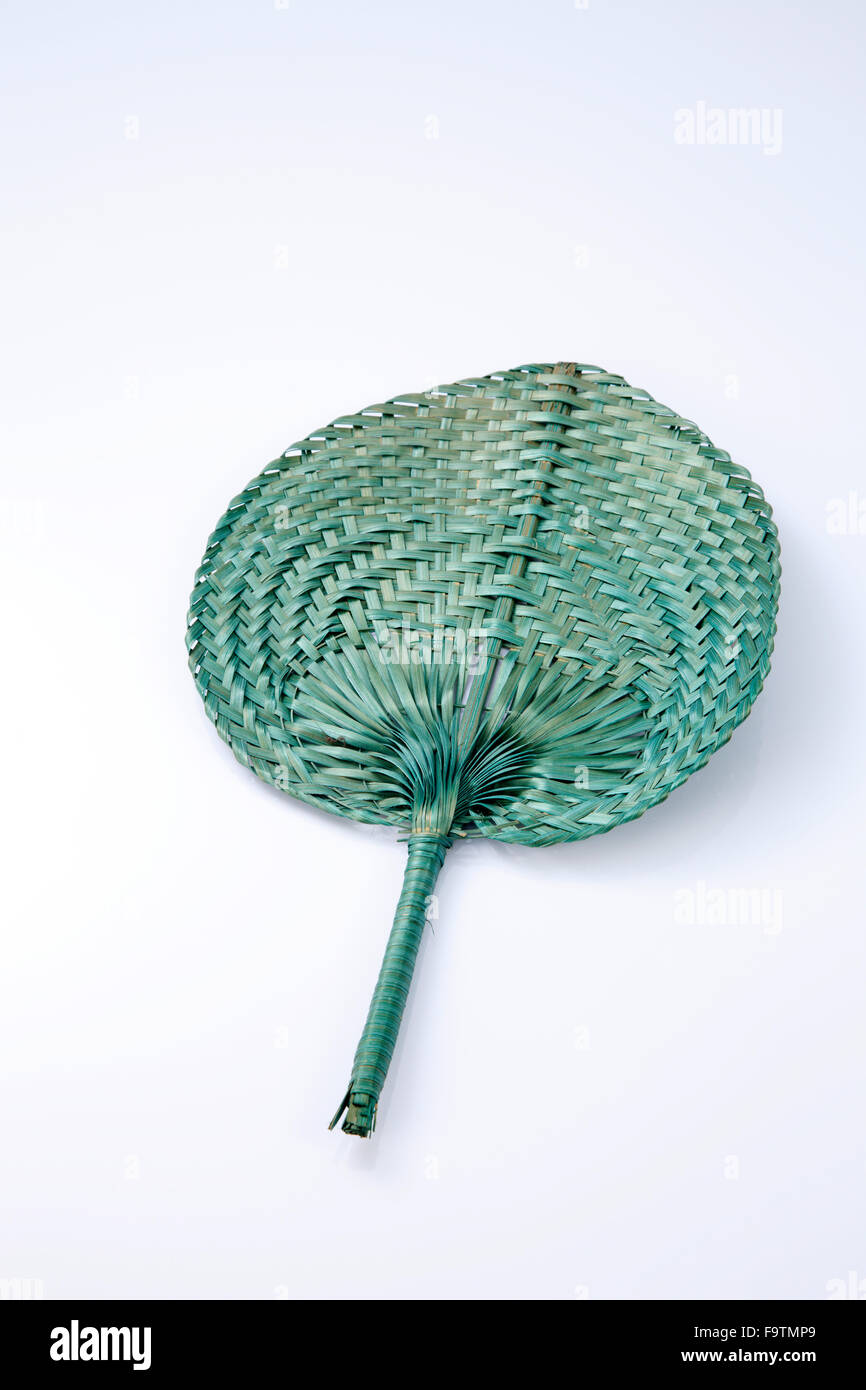 Green color native fan made from palm leaves on white background Stock ...