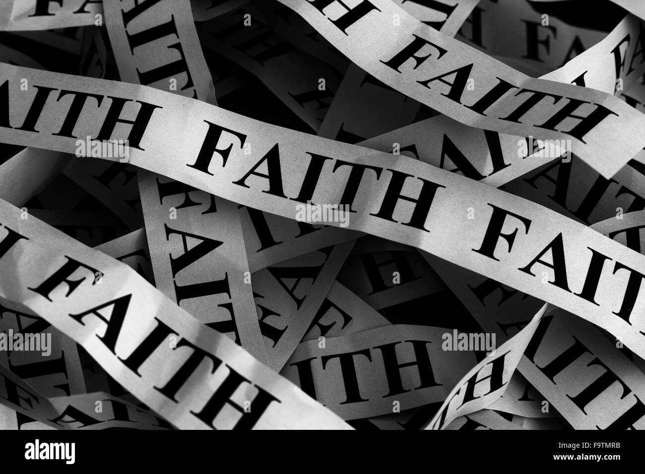 Crumpled paper pieces with word Faith Stock Photo - Alamy