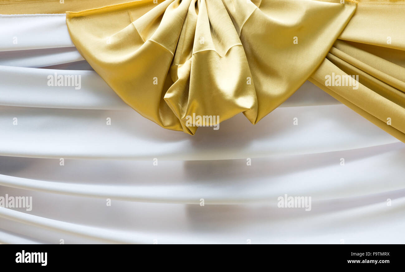 Golden and white fabric strip for decoration around the temple wall ...