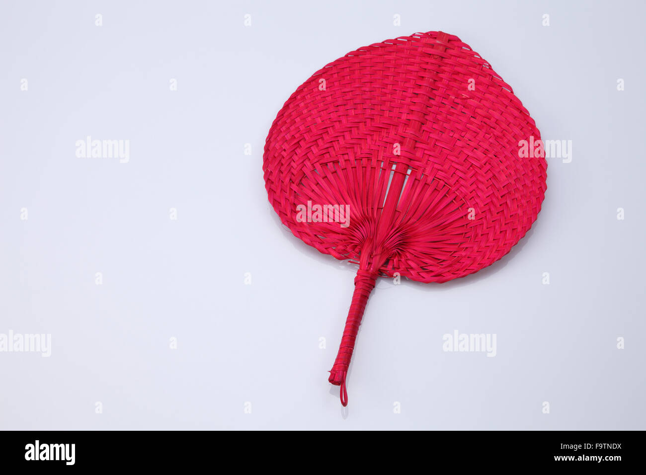Red color native fan made from palm leaves on white background Stock ...